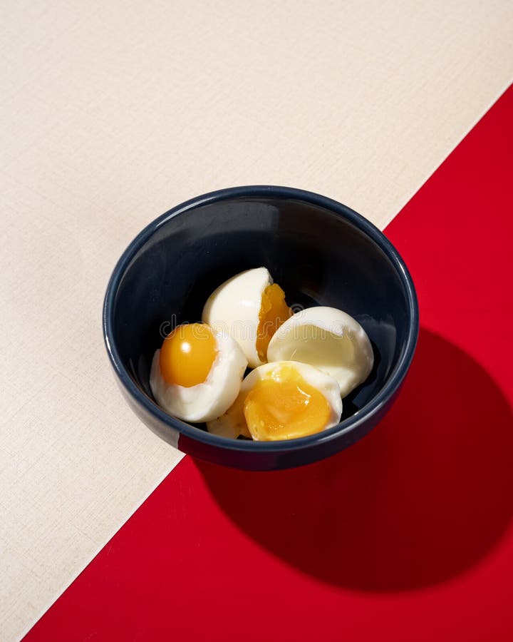 Processing Eggs by Boiling Them until they are Fully Cooked, Usually ...