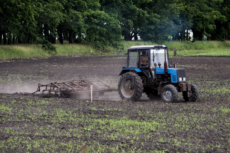 Processing a Farm Field with a New Modern Tractor Stock Image - Image ...