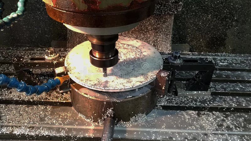 CNC Milling Machine in the Process of Processing a Workpiece in Three ...