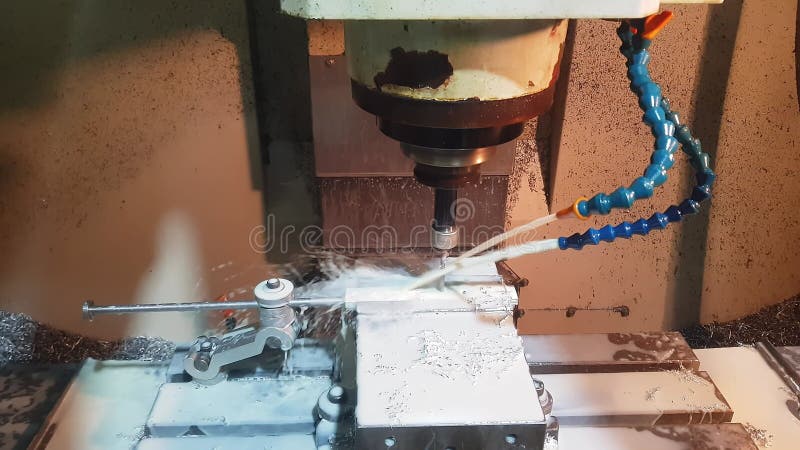 CNC Milling Machine in the Process of Processing a Workpiece in Three ...