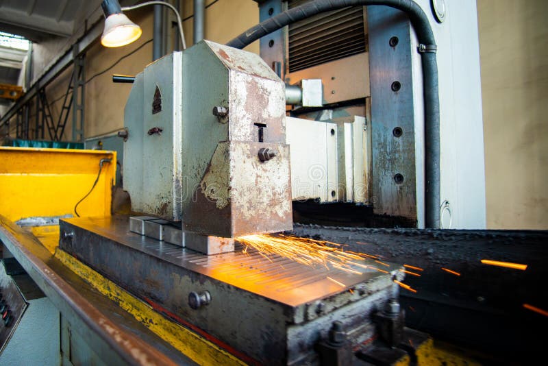 Iron Rectangular Parts on a Flat Grinding Machine are Treated with an ...