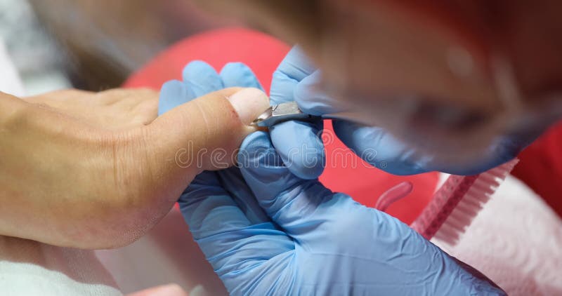 Processing Rough Cuticles of Toenails with Nippers Stock Footage ...