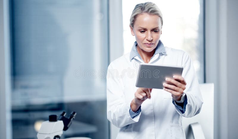 Processing Scientific Data on Her Device. a Mature Scientist Using a ...