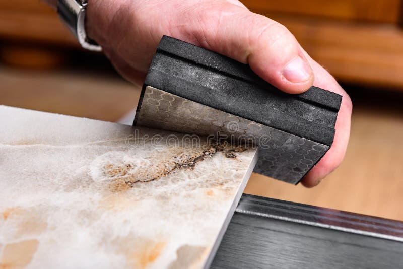 Processing of Tile Edges with Diamond Grinding Sponge. Stock Image ...