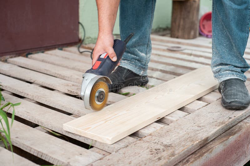 Processing the Wood with a Grinding Machine To Reveal the Texture. Man ...