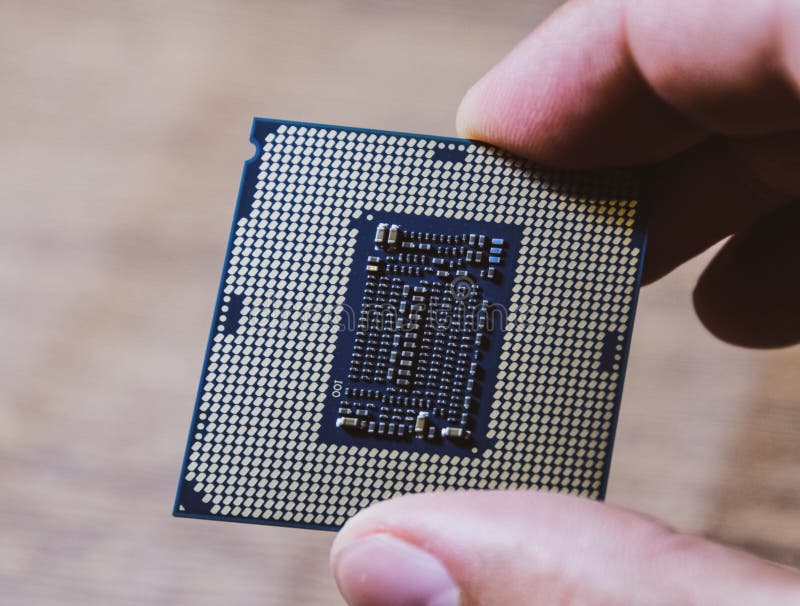 The is a Desktop Computer in Hand. Inspect the CPU Contacts before ...