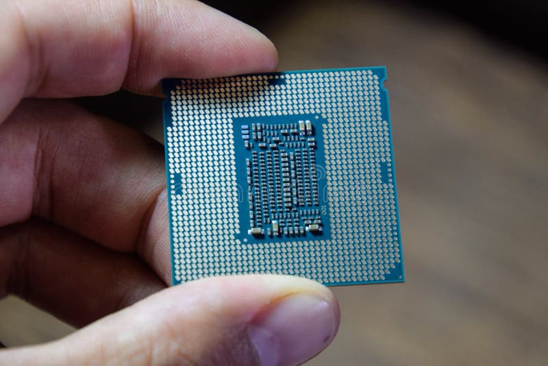 The is a Desktop Computer in Hand. Inspect the CPU Contacts before ...