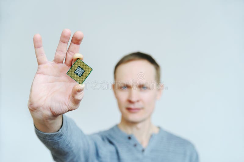CPU in the man`s hand. stock photo. Image of processor - 113062796