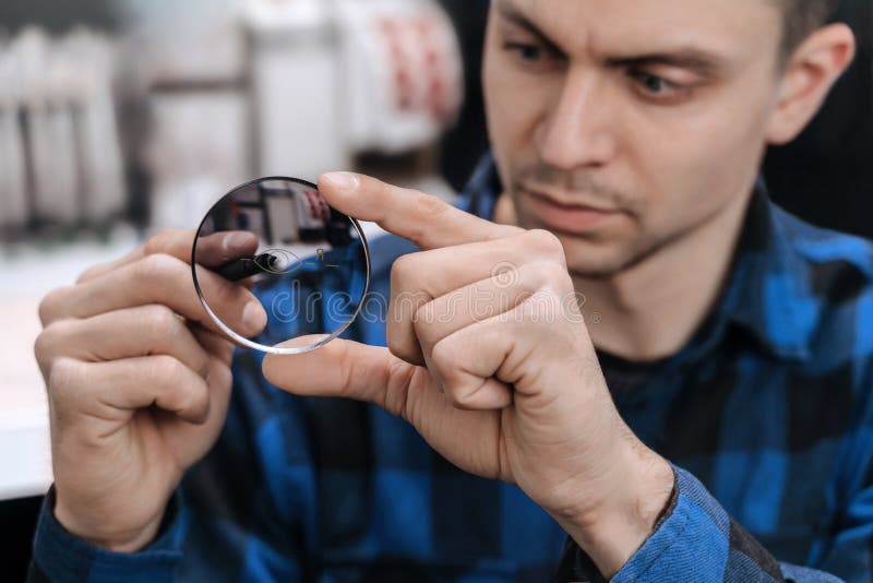 Production and Adjust of New Eyeglasses Lens in Optics Stock Photo ...