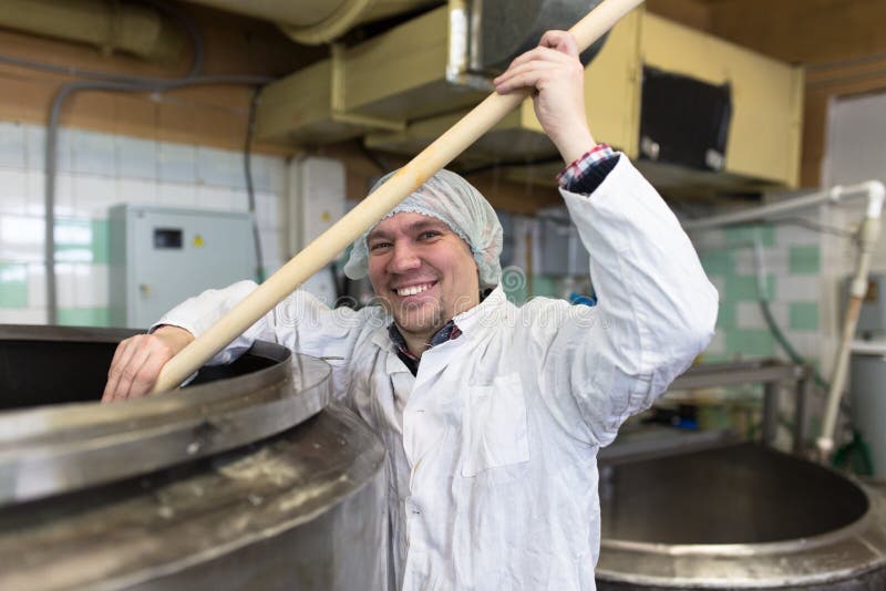 Production of Cheese in Dairy, Worker Cheese Mixes Stock Image - Image ...