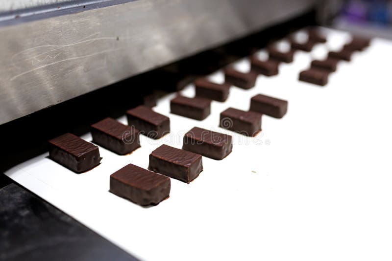 Production of Chocolate Candy. Sweets on Conveyor Belt at Factory Stock ...