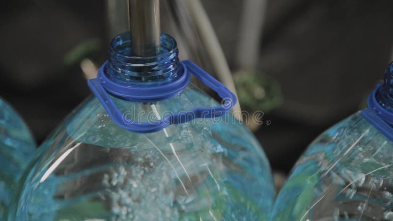 The Process of Filling Water into a Bucket for Household Use Stock ...