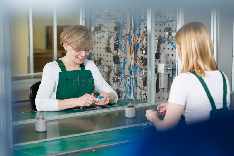 Female Assembly Line Workers Stock Photo - Image of female, indoor ...
