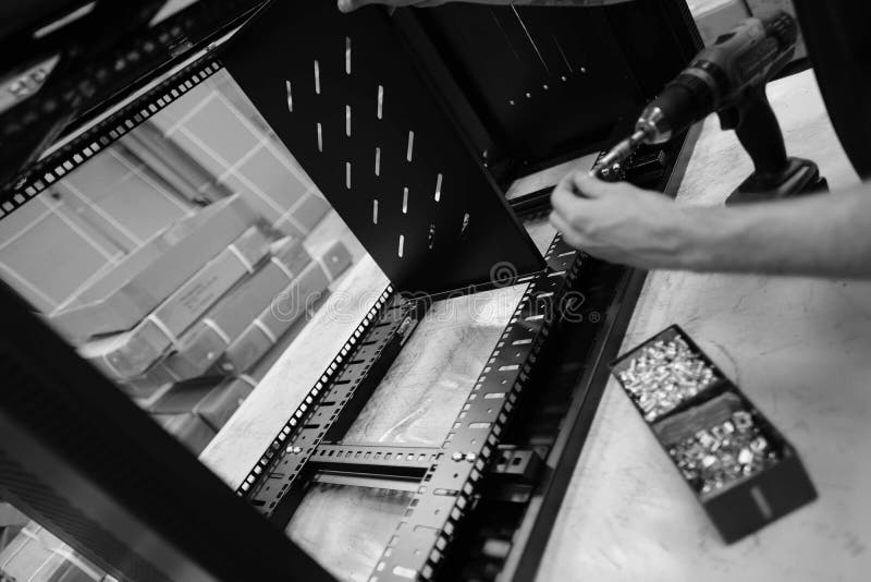 Production Line Worker Seen Assembling Data Cabinets at a Factory ...