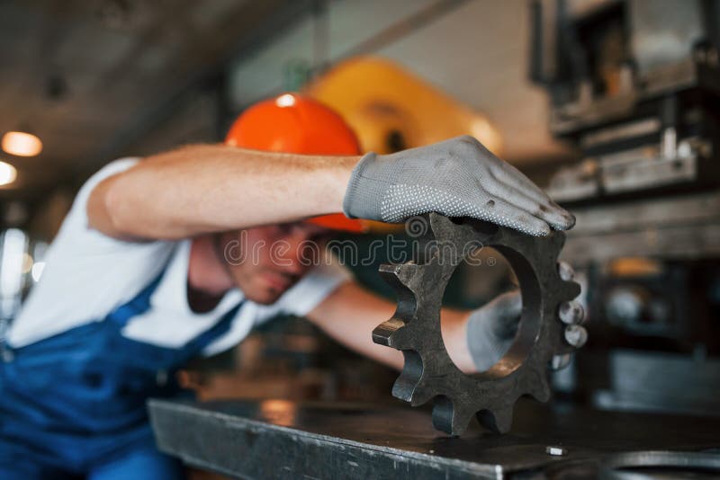 Before Production. Man in Uniform Works on the Production Stock Image ...