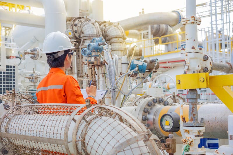 Production Operator Opening Valve On Offshore Oil And Gas Central ...