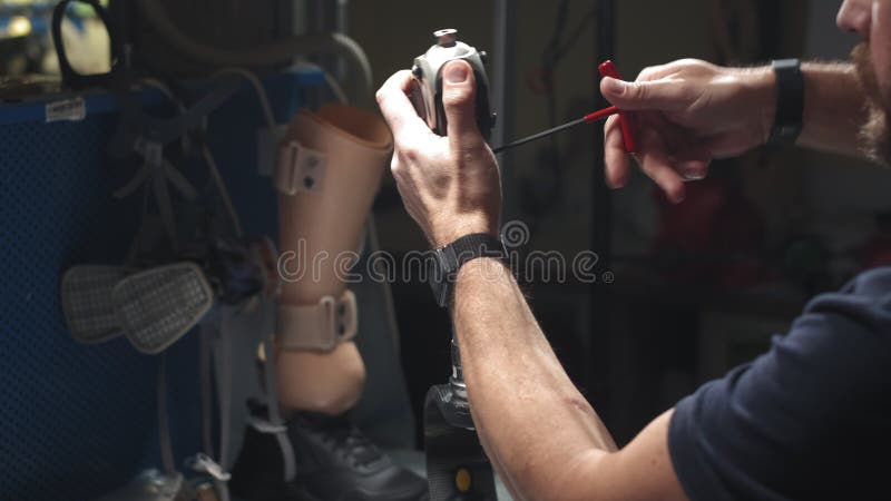 Production of a Prosthetic Leg. a Man Creates Part of the Leg Stock ...
