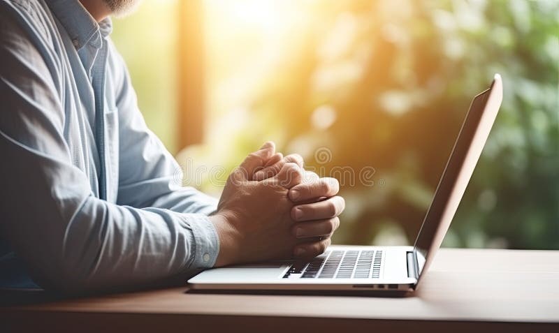 A Productive Workspace with a Focused Professional Working on a Laptop ...