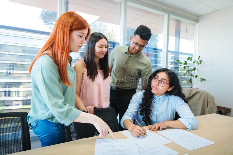 Young Professionals or Students Collaborating in a Bright Co-working ...