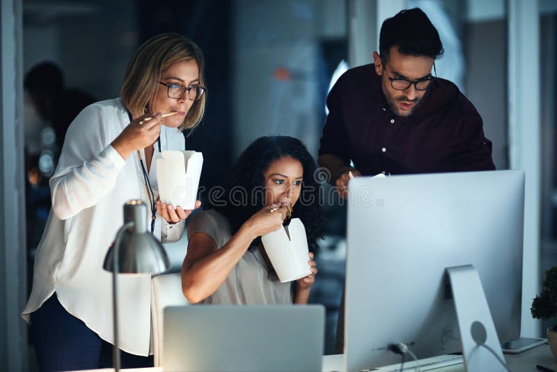 Productivity at Every Hour. a Group of Colleagues Using a Computer ...