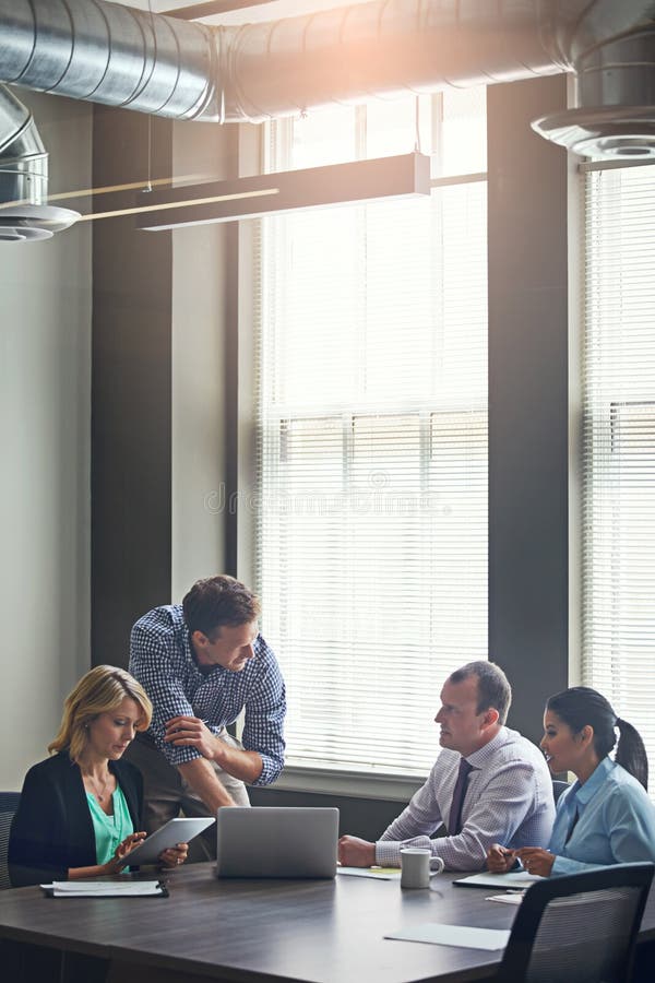 Productivity is Priority in this Meeting Room. a Group of Colleagues ...