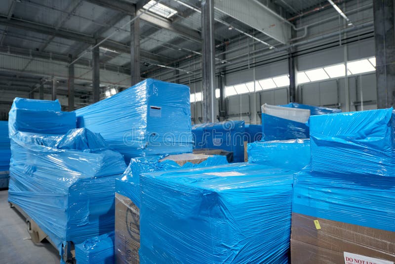 Products and Boxes are Stored in a Warehouse, Wrapped in Blue Stretch ...