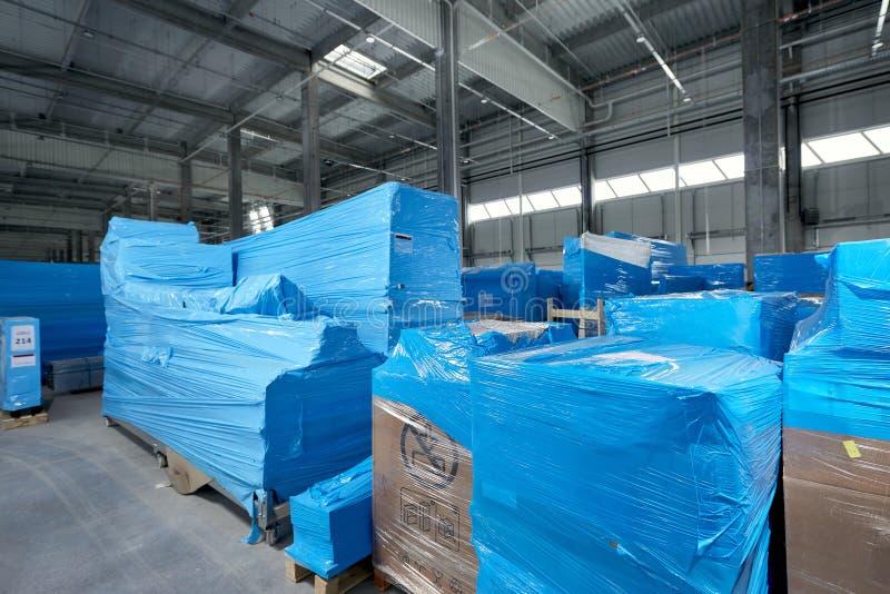 Products and Boxes are Stored in a Warehouse, Wrapped in Blue Stretch ...