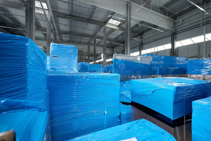 Products and Boxes are Stored in a Warehouse, Wrapped in Blue Stretch ...