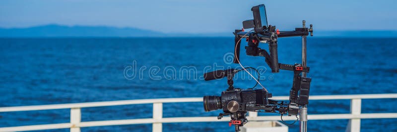 Profeccional Cinema Camera on a 3-axis Camera Stabilizer System on a ...