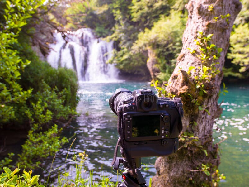 Profesional DSLR Camera on a Tripod at Beautiful Waterfall Stock Photo ...
