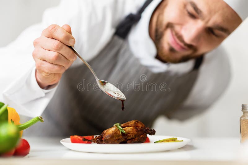 Cook Man Pouring Sauce on Chicken Plating Dish in Kitchen Stock Photo ...