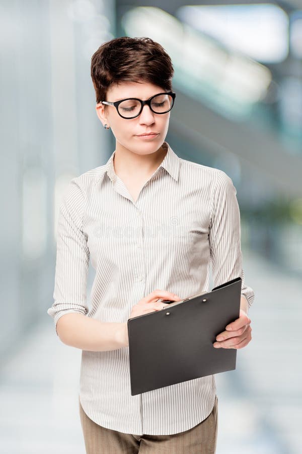 Professional Accountant with Folder Reads a Document Stock Photo ...