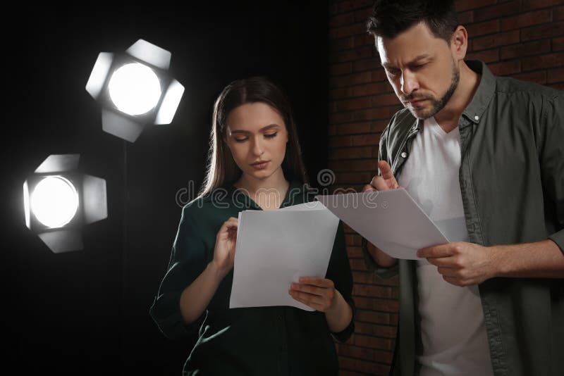 Professional Actors Reading Scripts during Rehearsal in Theatre Stock ...