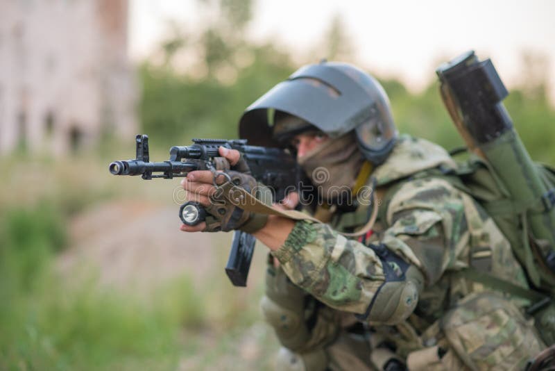 A Professional Airsoft Player Aims at His Opponents. Stock Image ...