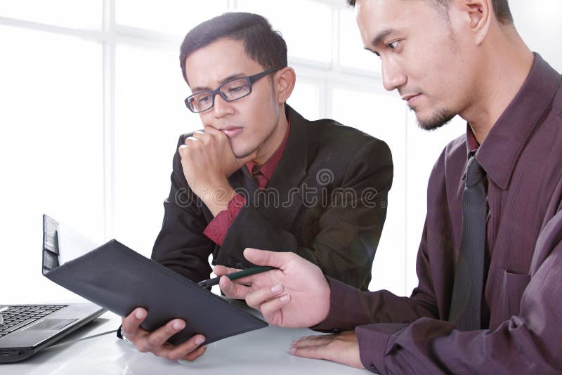 Professional Analysts Discussing a Business Report Stock Image - Image ...