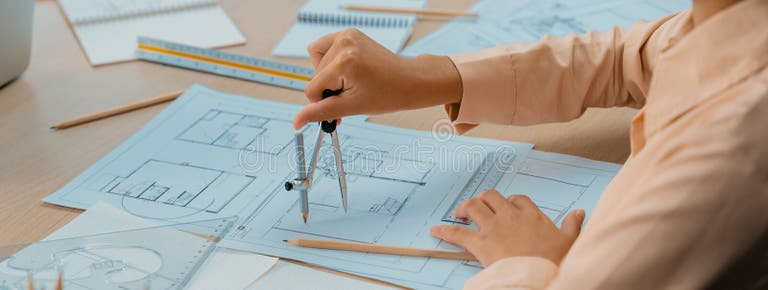 Professional Architect Drawing Blueprint by Using Divider. Closeup ...