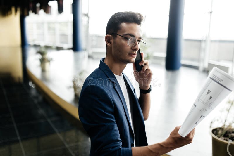 Professional Architect Dressed in Stylish Clothes Stands in the Hall of ...