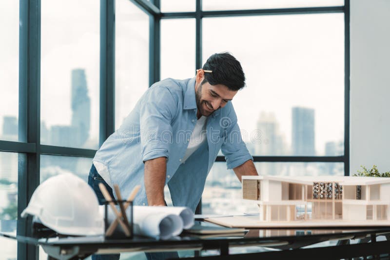 Professional Engineer Inspecting House Model while Designing Building ...