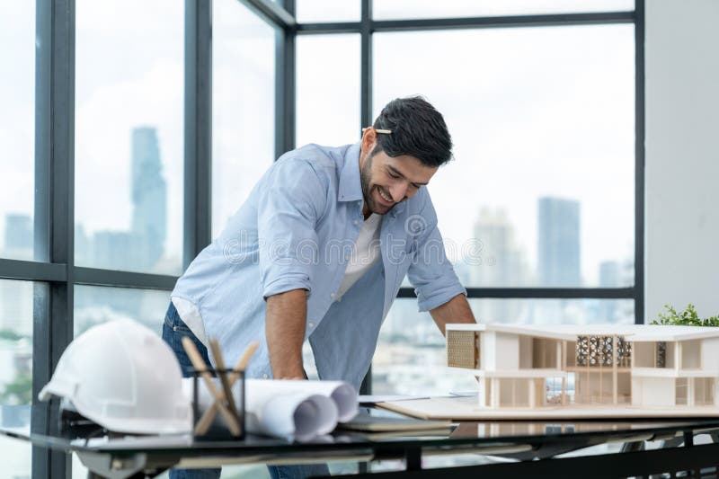 Professional Engineer Inspecting House Model while Designing Building ...