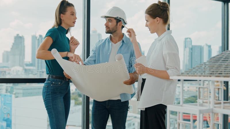 Engineer Team Talk about Design while Manager Hold at Project Plan ...