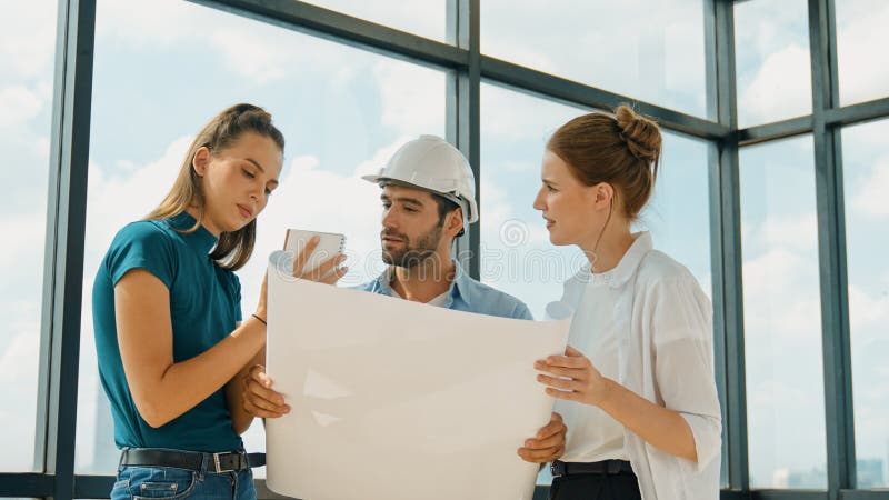 Engineer Team Talk about Design while Manager Hold at Project Plan ...