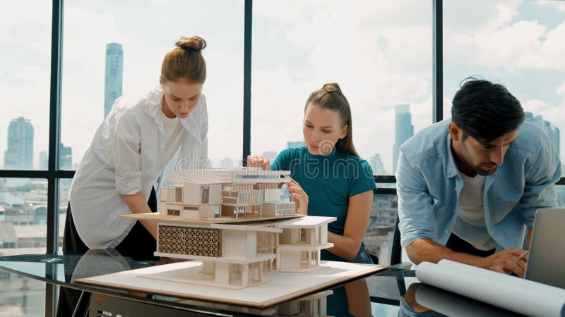 Engineer Team Working Together To Analyze House Model Construction ...