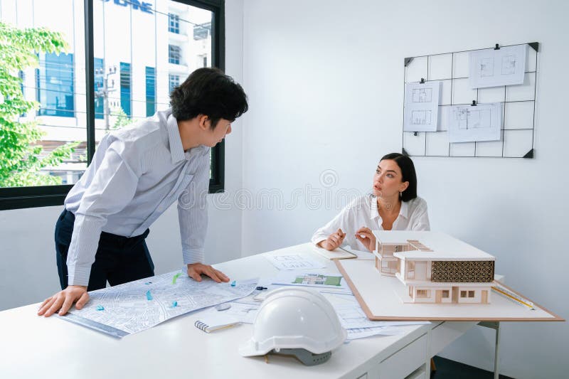 Professional Architect Team Discuss about House Design at Office ...