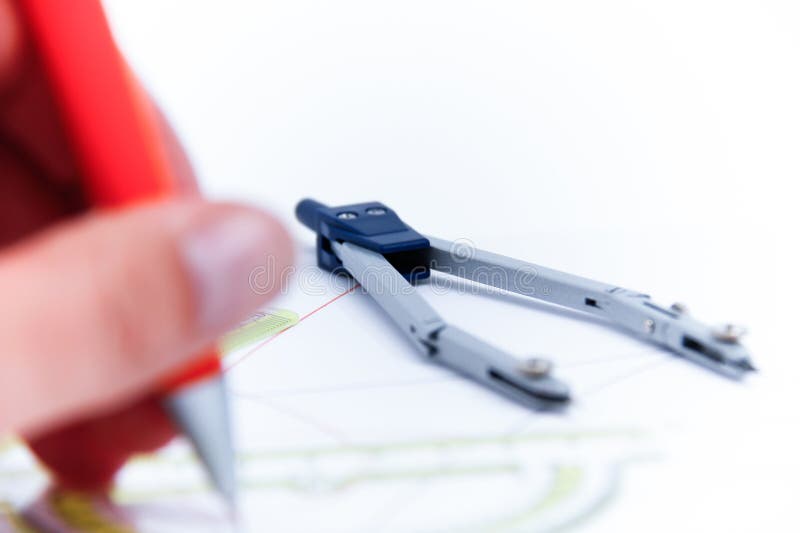 Professional Architect Working at His Desk, Measuring and Estimating ...