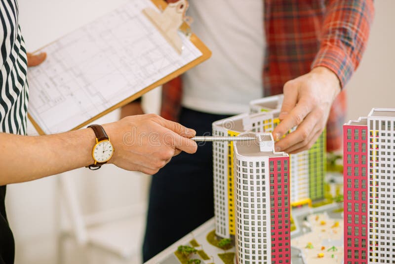 Architects Creating New Project with the Use of Small Model of High ...