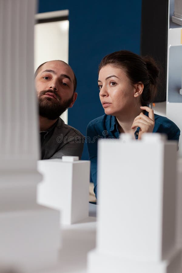 Professional Architects Team Inspecting Skyscraper White Foam Model ...