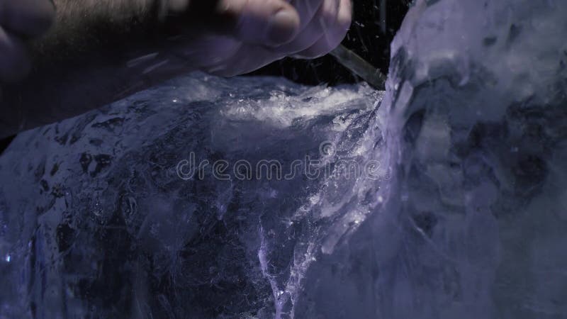 Using Chisel and Hammer To Create Details on an Ice Sculpture, Artist ...