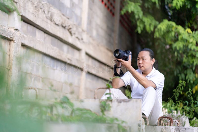 Professional Asian Chinese - Thai Camera Man Posture and Focus in ...