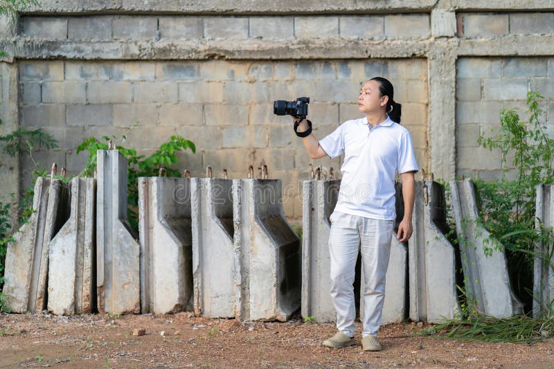 Professional Asian Chinese - Thai Camera Man Posture and Focus in ...