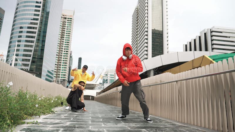 Professional Asian Hipster Doing Head Spin while Friend Cheering Him ...
